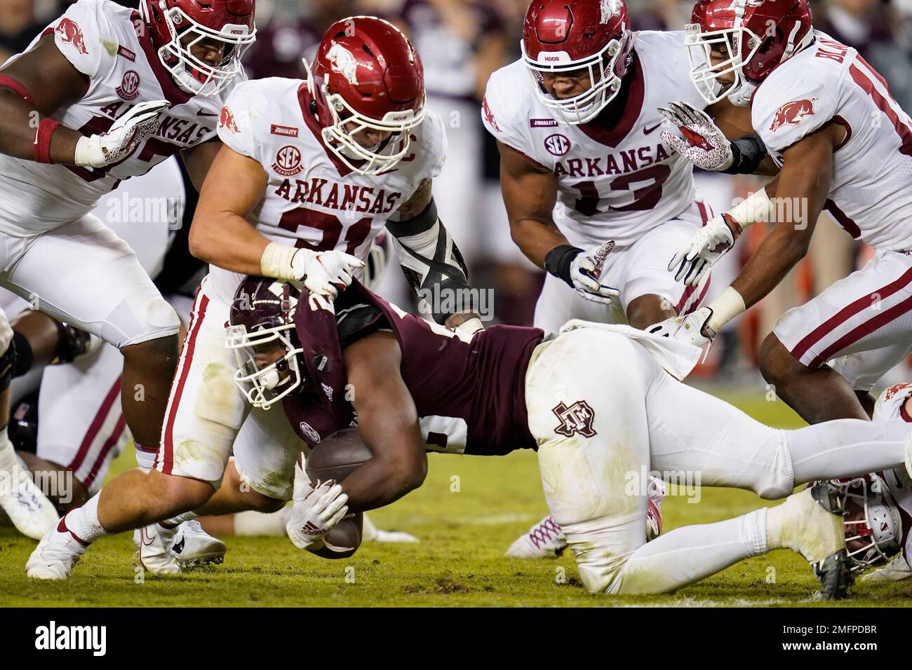 Arkansas linebacker Grant Morgan (31) tackles Texas A&M running back ...