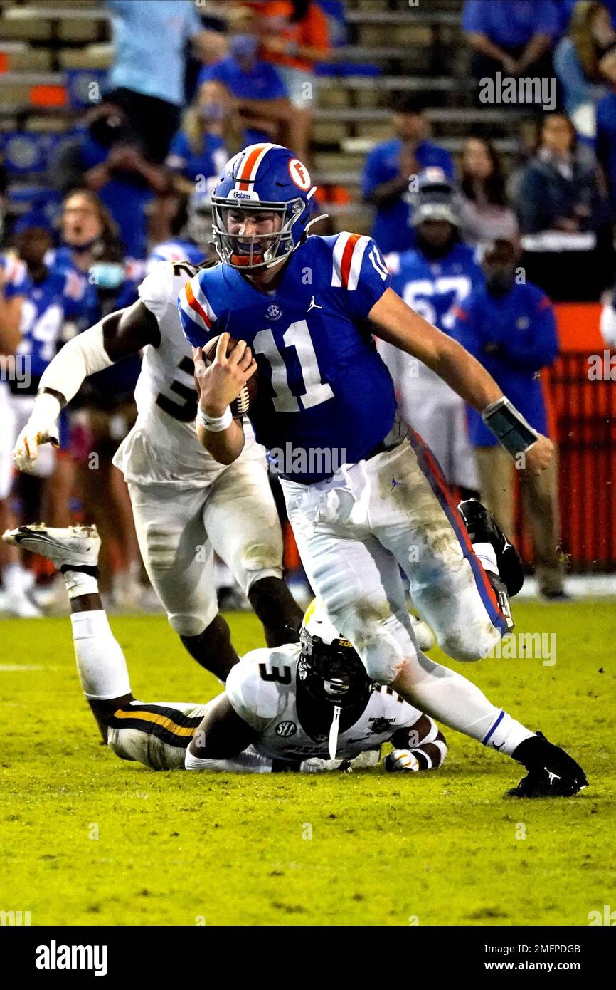 Florida quarterback Kyle Trask (11) runs for yardage past Missouri's ...