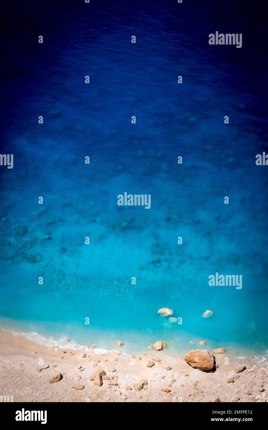 Beautiful crystal clear blue and turquoise waters next to a sandy beach ...