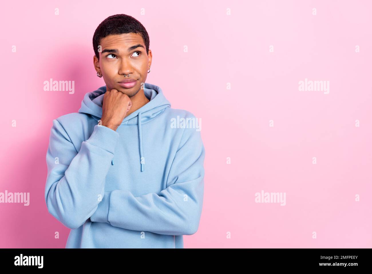 Portrait of minded pensive person hand fist touch chin look empty space ...