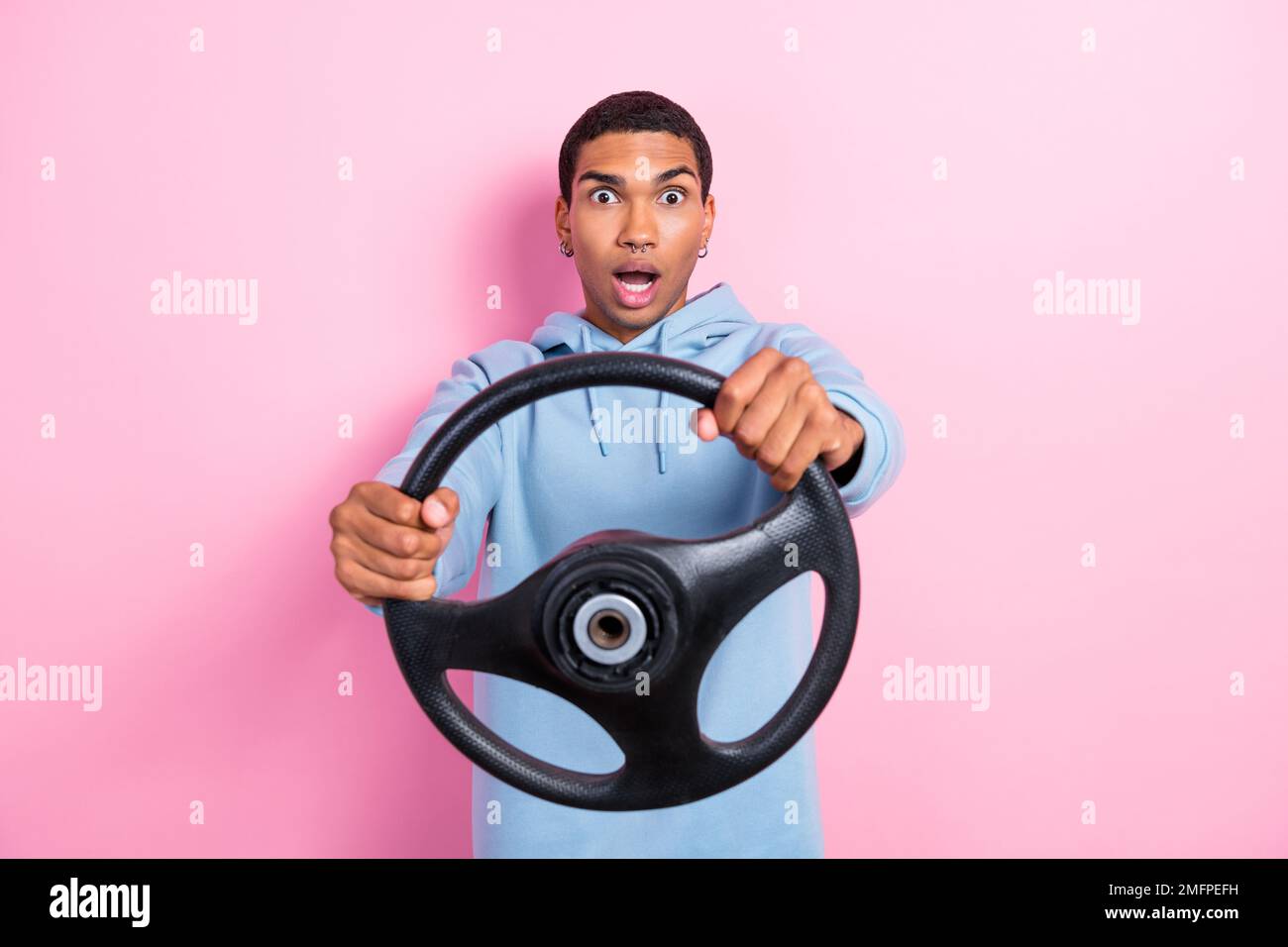 Photo of young surprised shocked confused man first time car driving ...