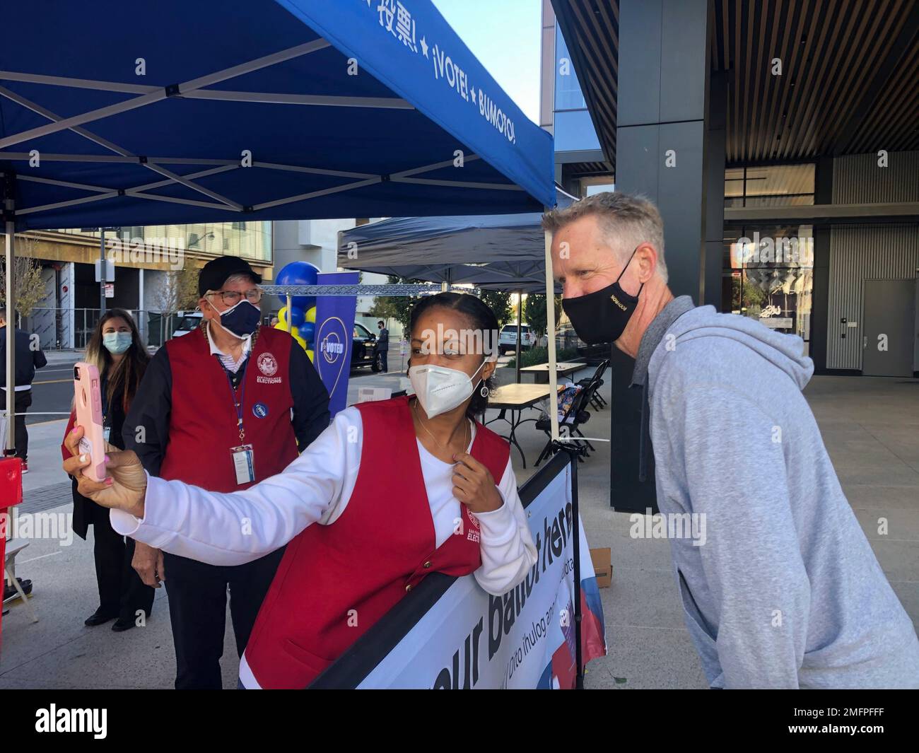 Golden State Warriors coach Steve Kerr poses for a selfie with voting ...