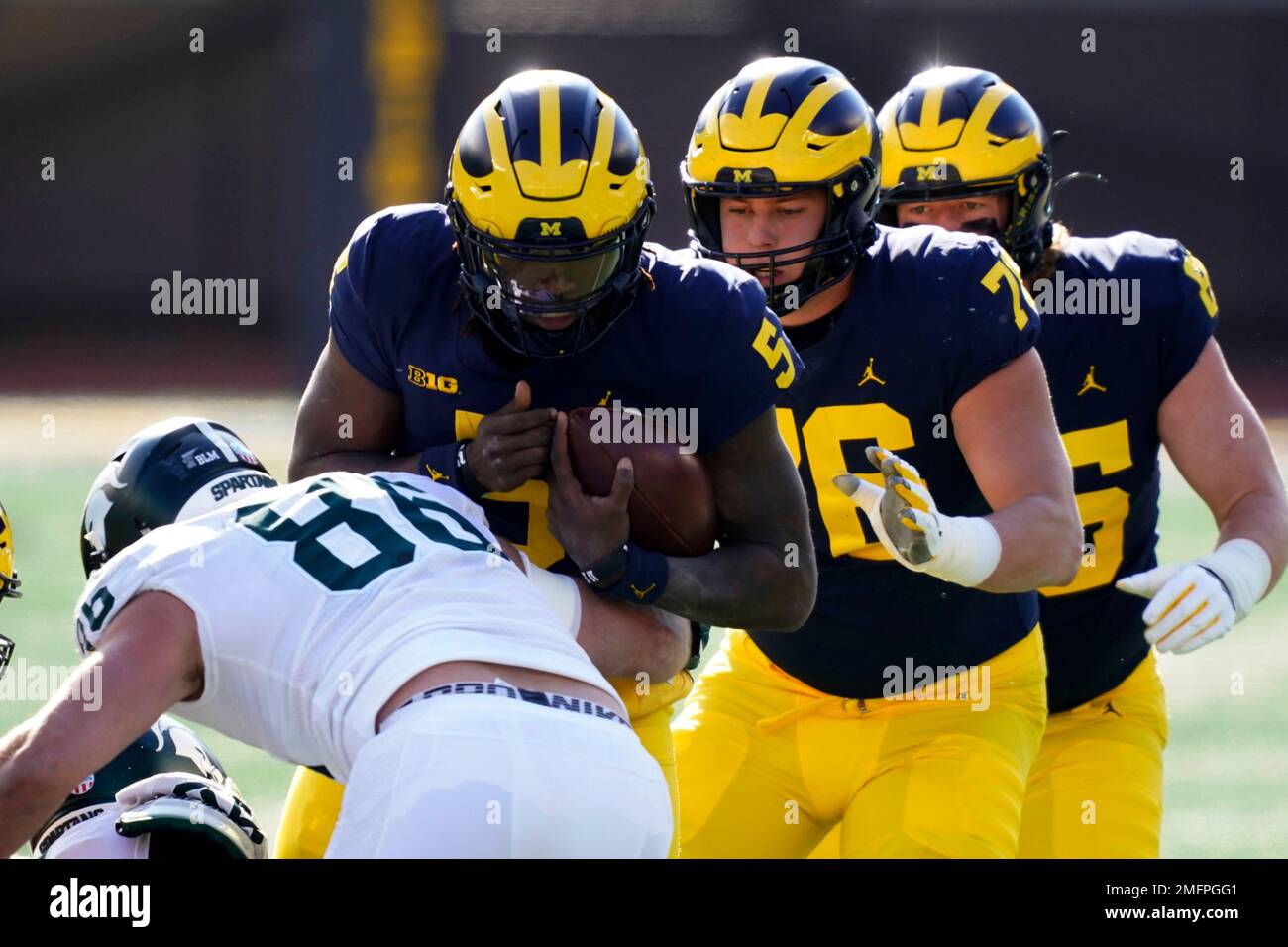 Michigan quarterback Joe Milton (5) is sacked by Michigan State ...