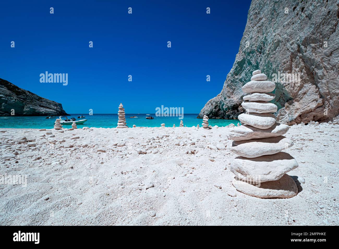 View of cairns, stacks of balanced white round stones, on the beautiful ...