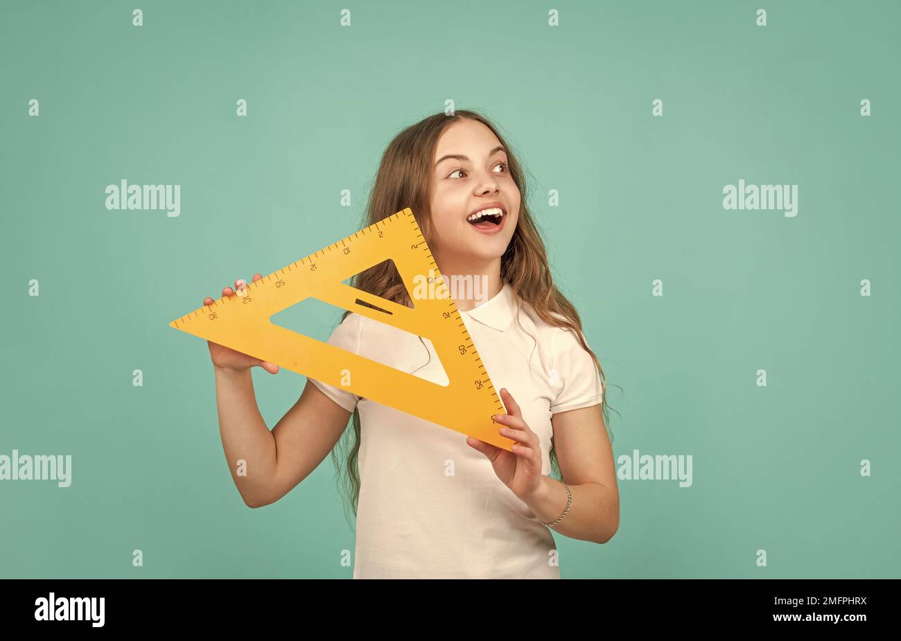 cheerful child with math triangle measuring tool Stock Photo - Alamy