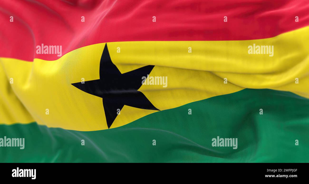 Close-up view of Ghana National flag waving. Red, yellow, green stripes ...