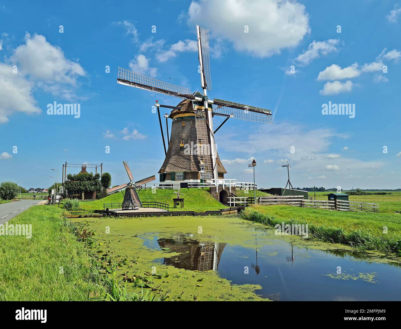 Traditional windmill in a dutch landscape in spring in the Netherlands ...