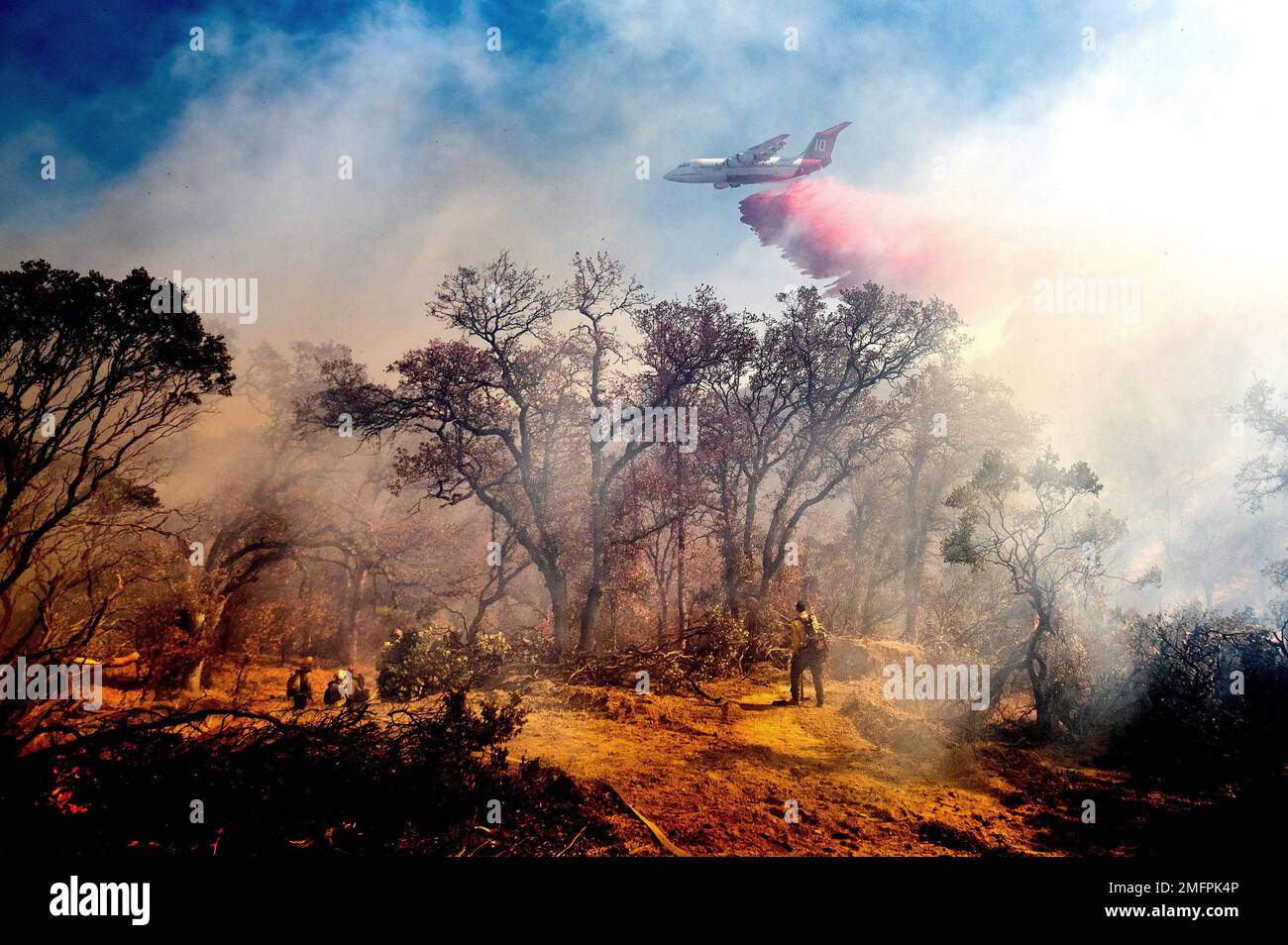 An air tanker drops retardant on the Olinda Fire in Anderson, Calif ...