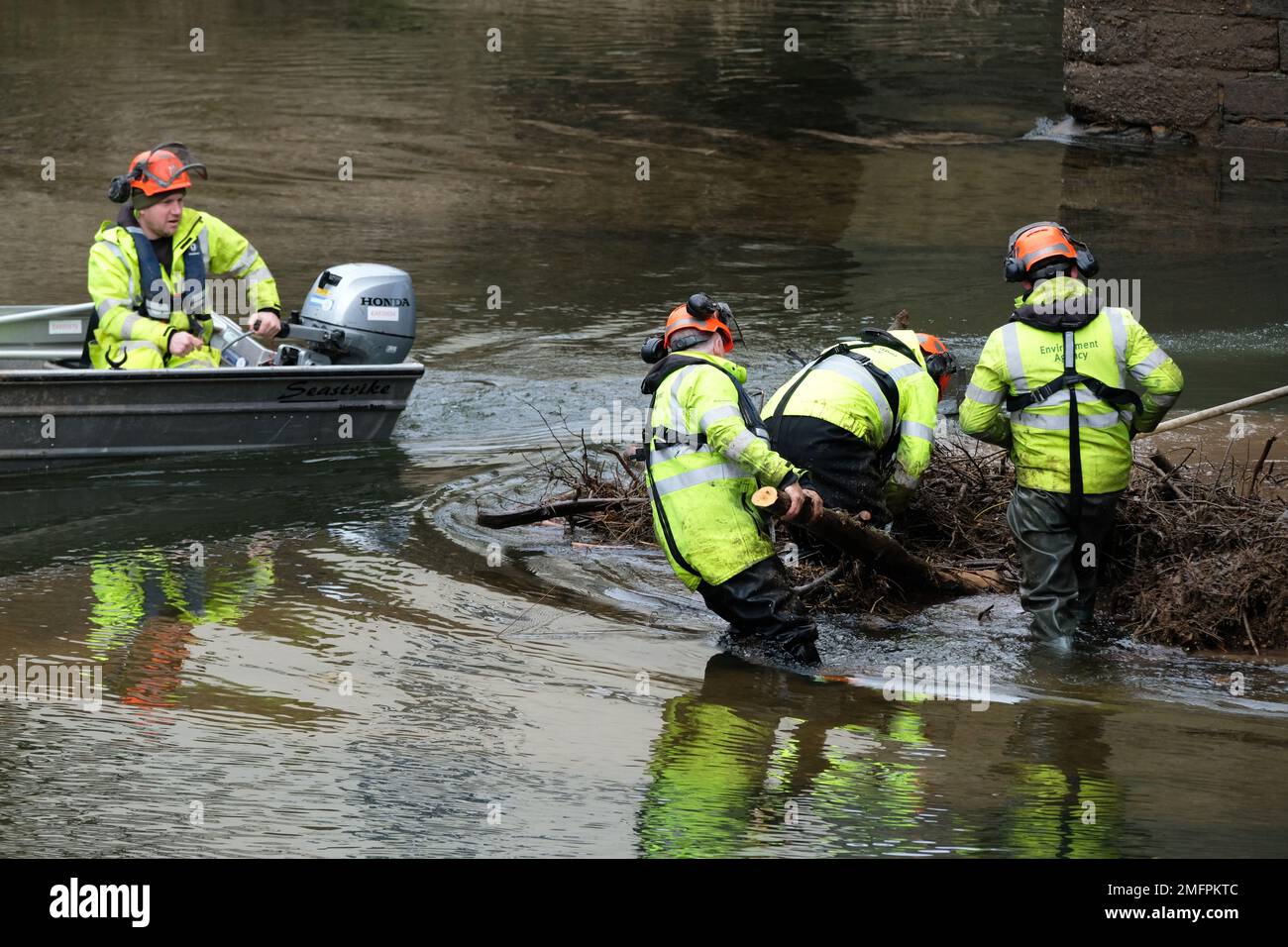 Environment Agency staff workers working in the River Wye at Hereford ...