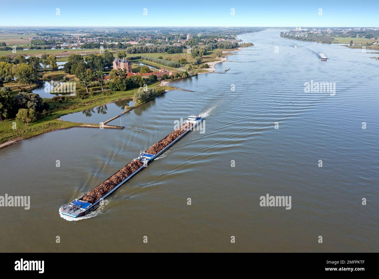 Aerial from shipping on the river Merwede near castle Loevestein in the ...