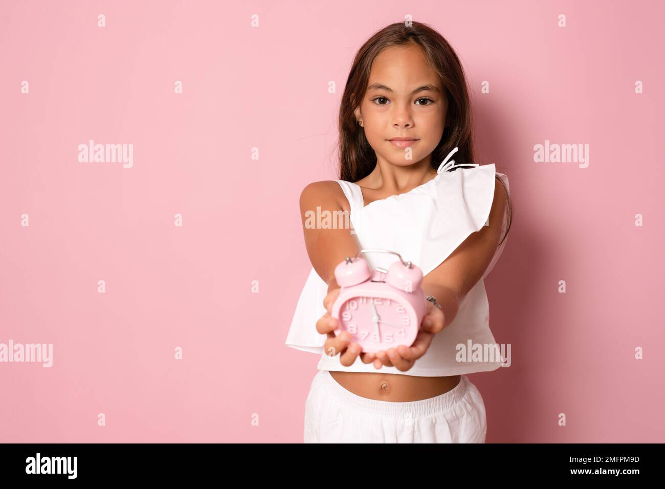 Image of cheerful little girl child standing isolated over pink ...