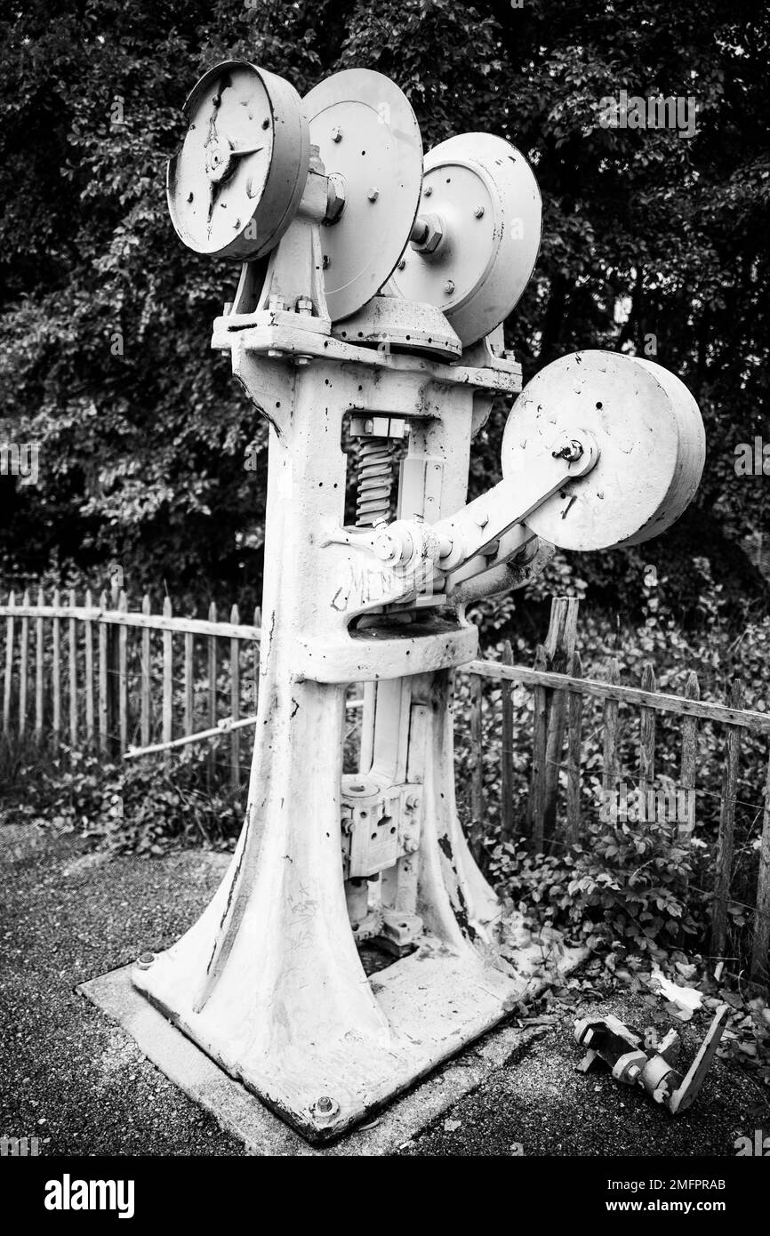 A grayscale shot of old and abandoned machinery in Nyon station ...