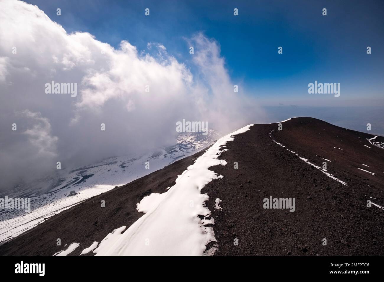 Thick clouds are moving toward the craters of Mount Etna, Mongibello ...