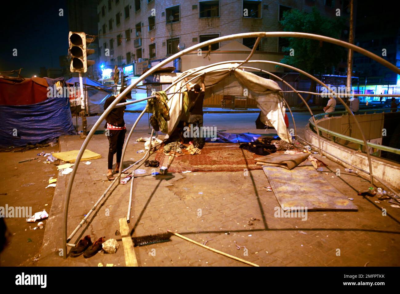 Anti-government protesters dismantle their tent in Tahrir Square ...