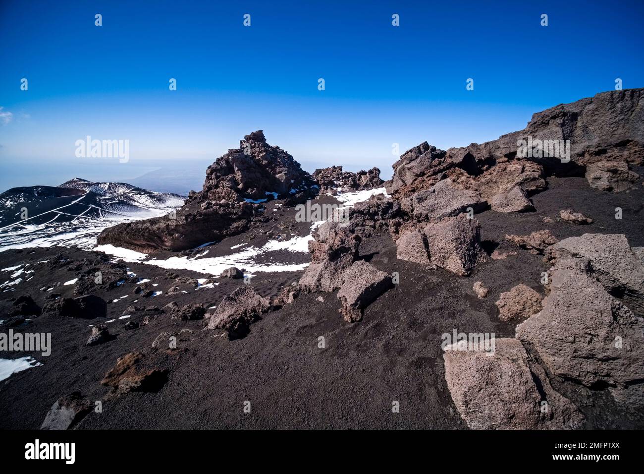 Landscape with solidified lava on the slopes of Mt. Etna, with more ...