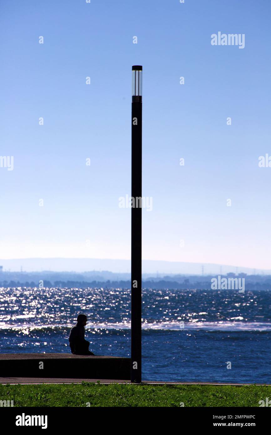 Seated man observes hi-res stock photography and images - Alamy