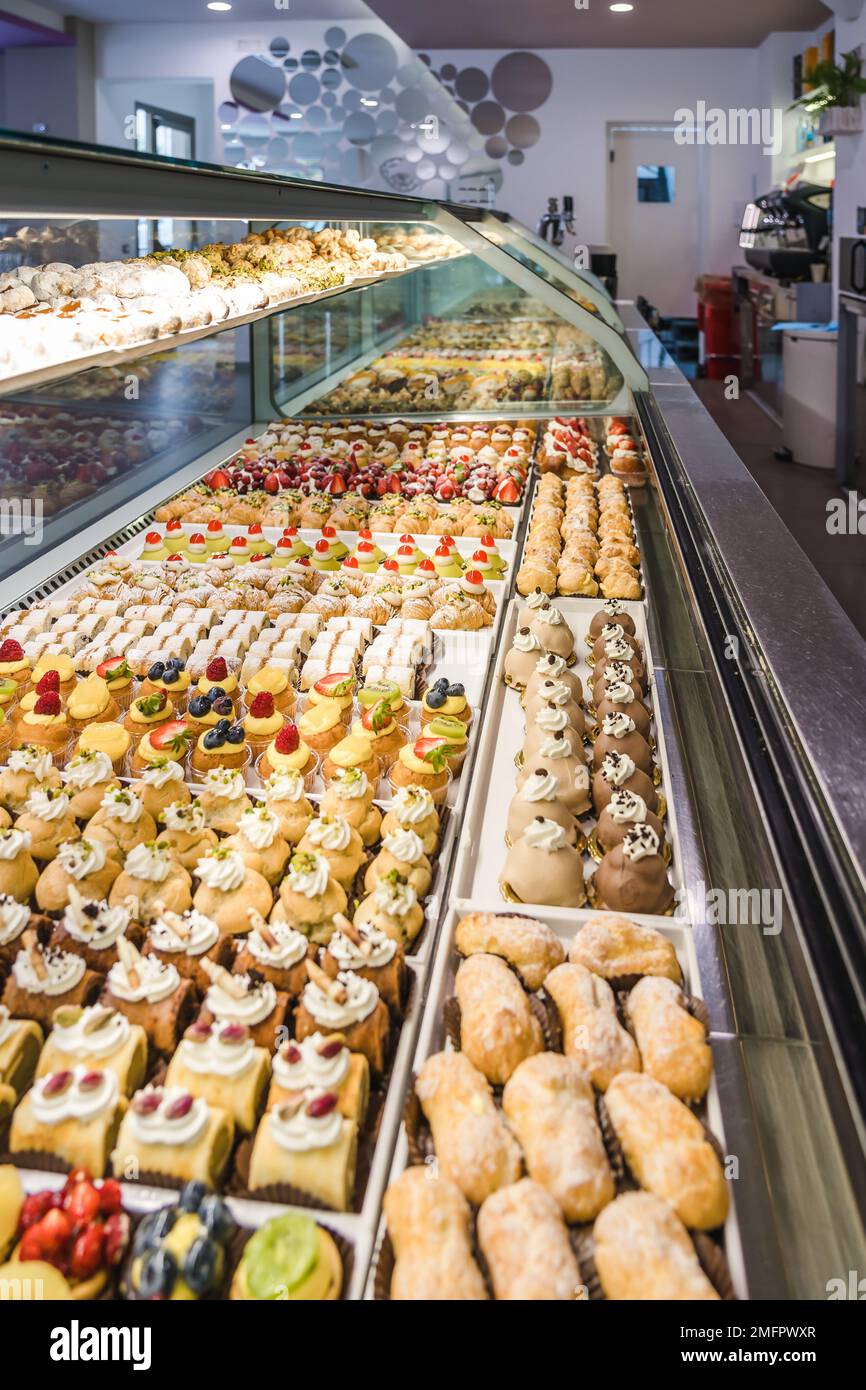 Italian Bakery counter, Window of desserts at a pastry shop. Fresh and ...