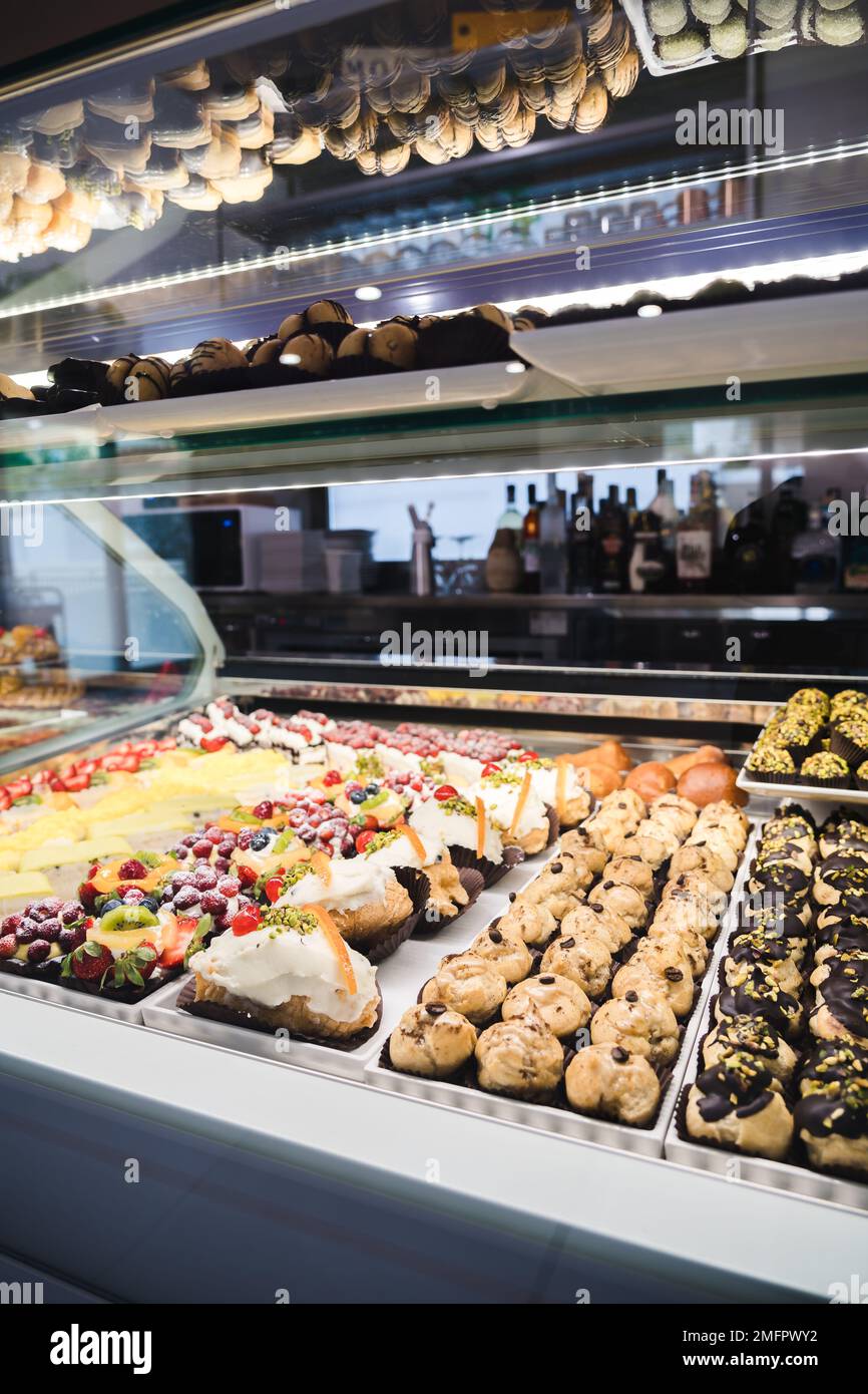 Italian Bakery counter, Window of desserts at a pastry shop. Fresh and ...