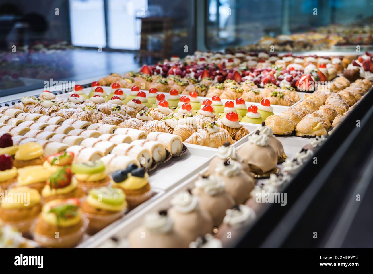 Italian Bakery counter, Window of desserts at a pastry shop. Fresh and ...