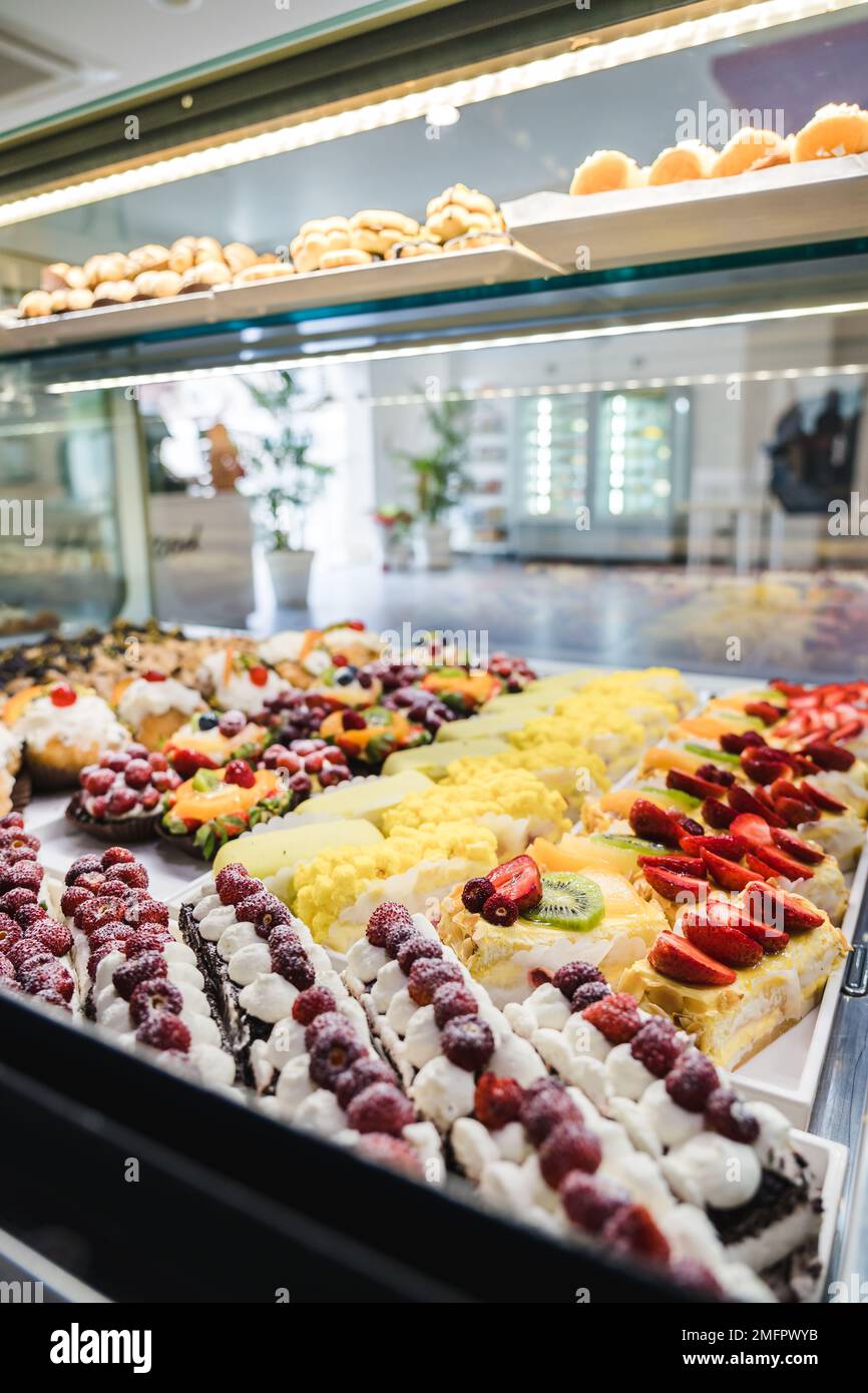 Italian Bakery counter, Window of desserts at a pastry shop. Fresh and ...