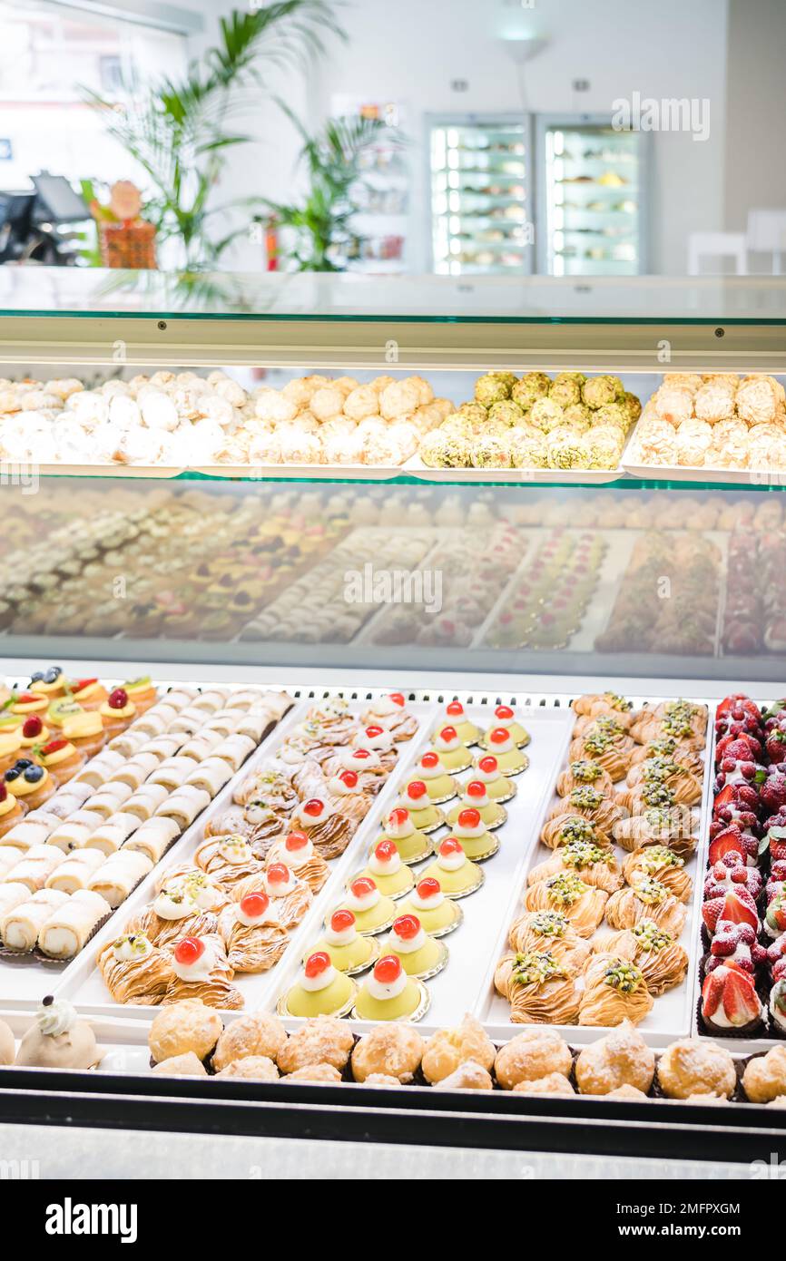 Italian Bakery counter, Window of desserts at a pastry shop. Fresh and ...