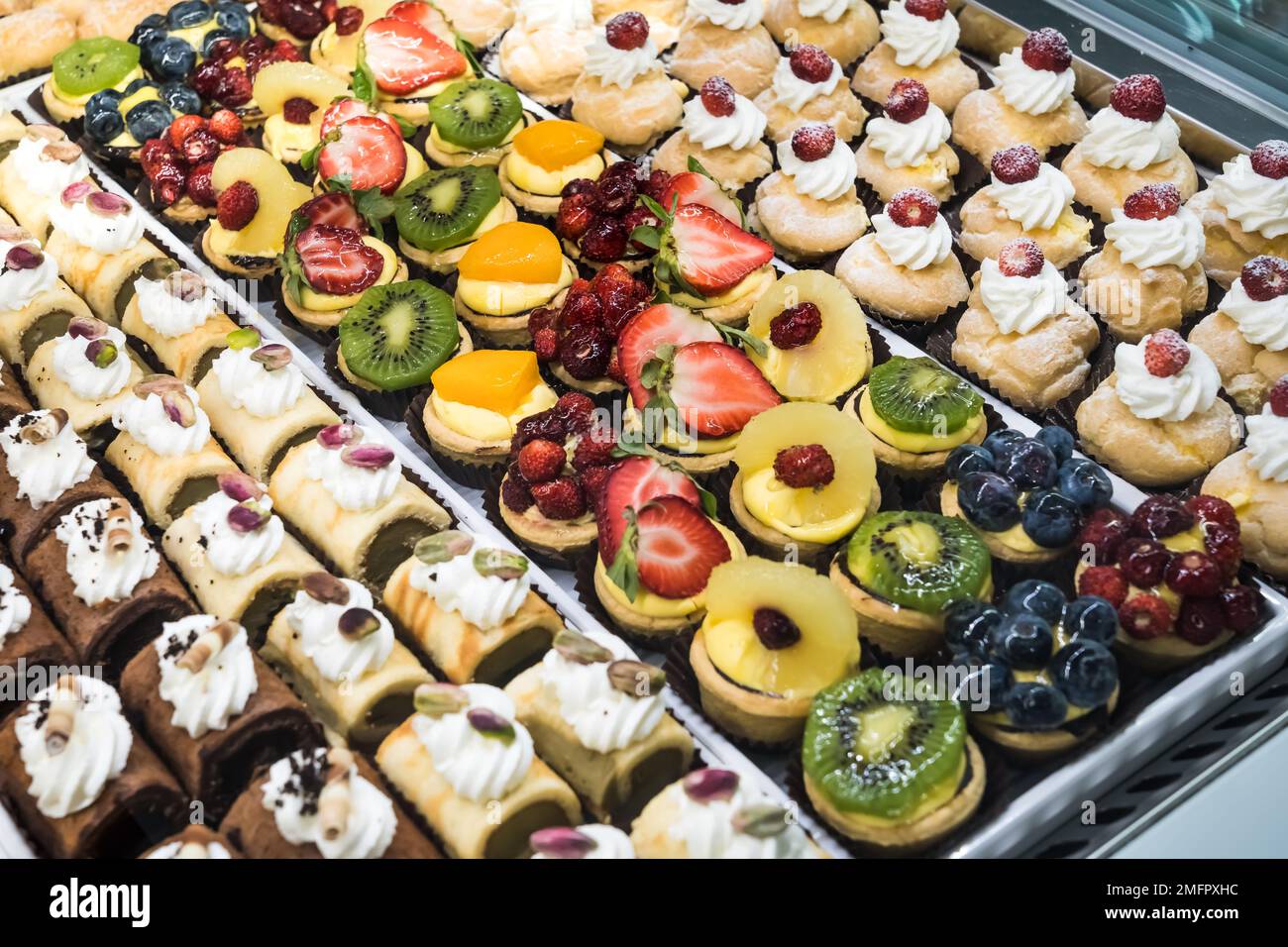 Italian Bakery counter, Window of desserts at a pastry shop. Fresh and ...