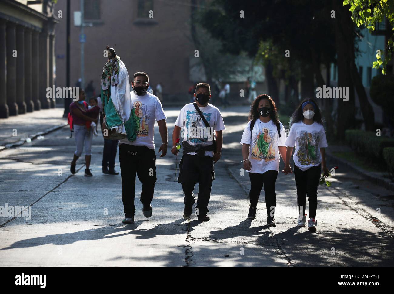 Devotees, wearing protective face masks amid the new coronavirus ...