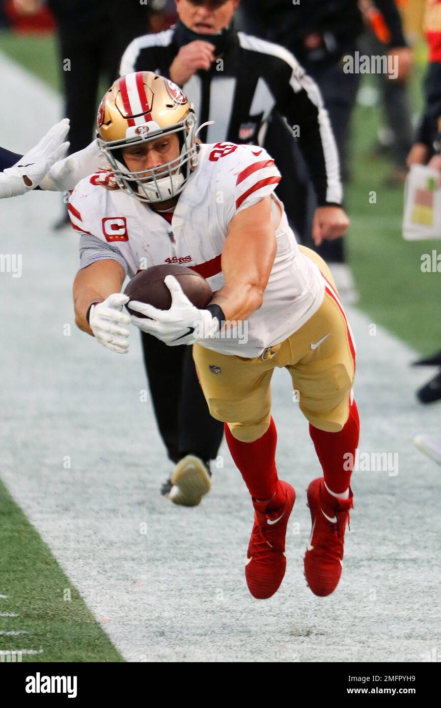 San Francisco 49ers tight end George Kittle stretches for a first down ...