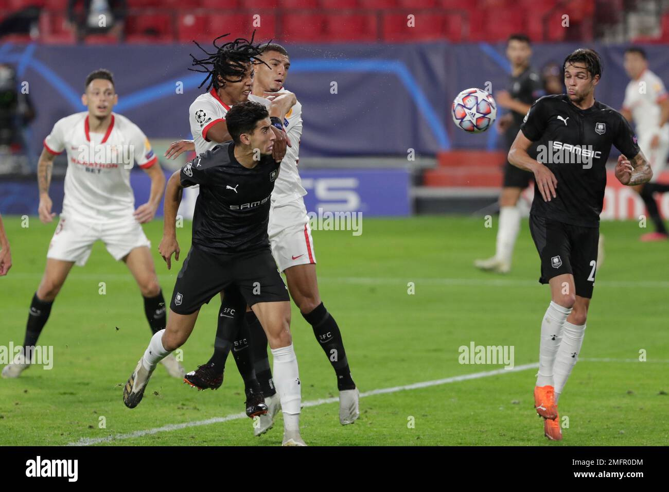 Sevilla's Jules Kounde, center, heads the ball during the Champions ...