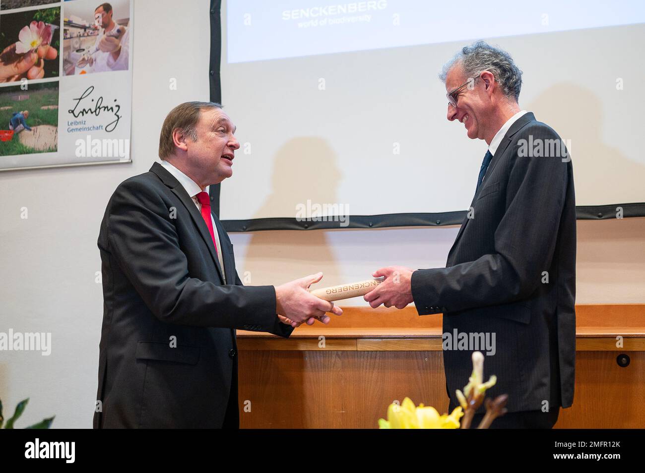 25 January 2023, Saxony, Görlitz: Willi Xylander (l) passes the baton ...