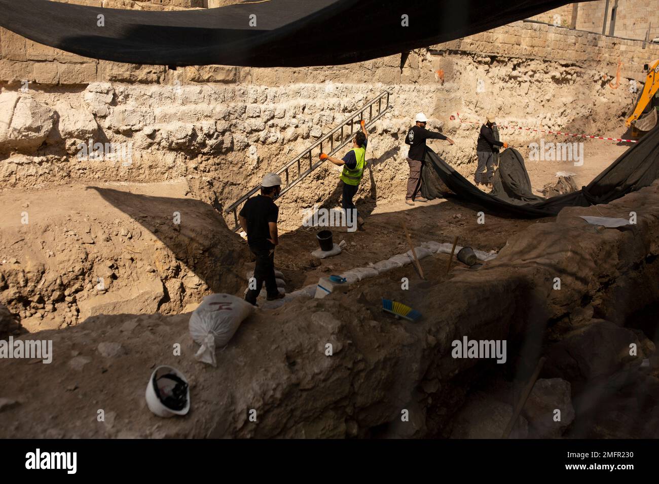 Workers excavate inside the Tower of David Museum in the Old City of ...