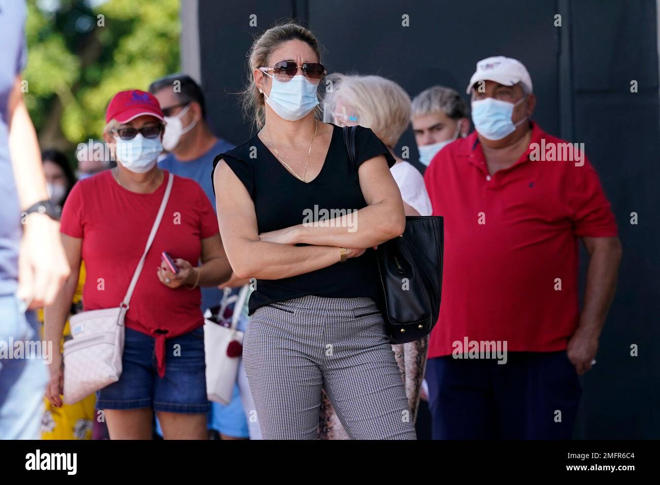 People stand in line for early voting at the John F. Kennedy Library ...