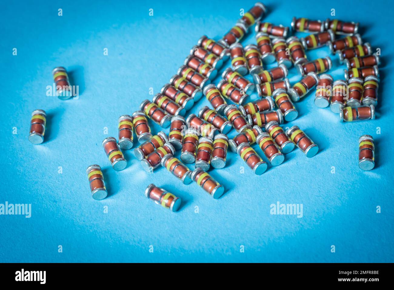SMD diodes, on a table with a blue background, electronic components ...