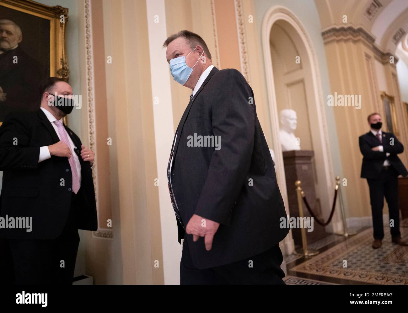 Sen. Jon Tester, D-Mont., walks to the chamber for a procedural vote ...