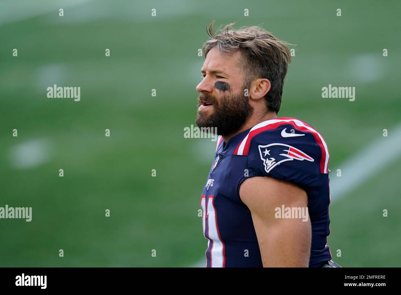 New England Patriots wide receiver Julian Edelman warms up before an ...