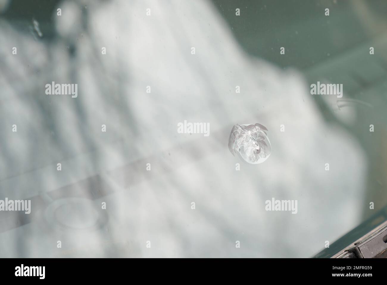 Broken car windshield damaged front glass windscreen with trace of ...