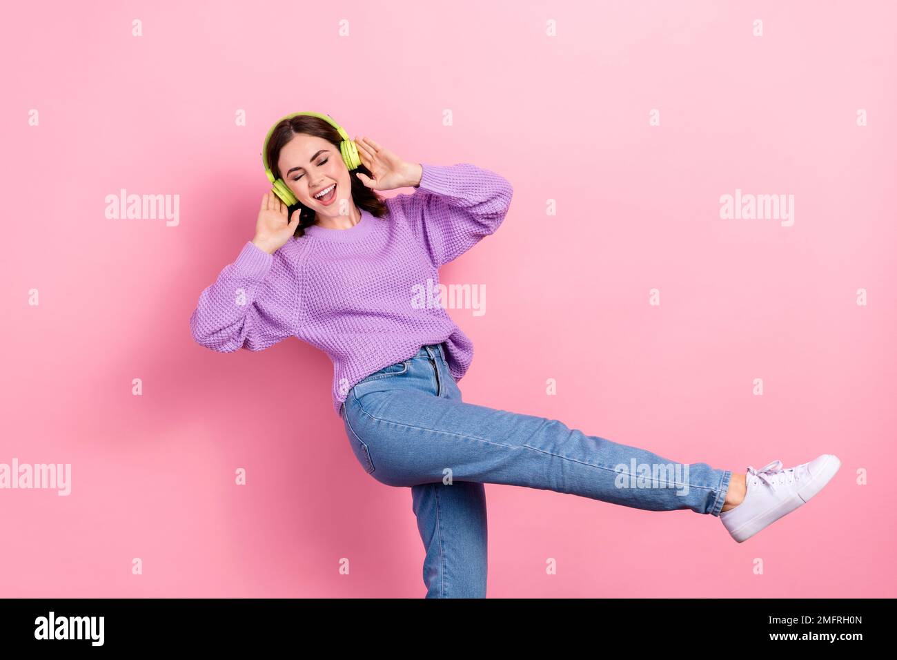 Photo of sweet pretty lady wear violet sweater enjoying songs having ...