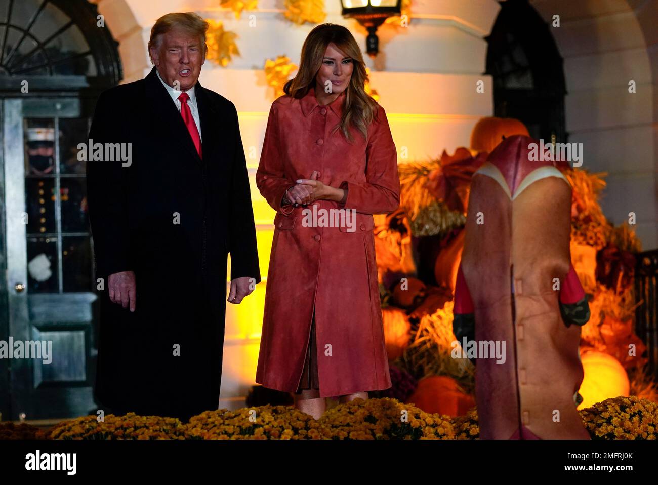 President Donald Trump and first lady Melania Trump greet trick-or ...