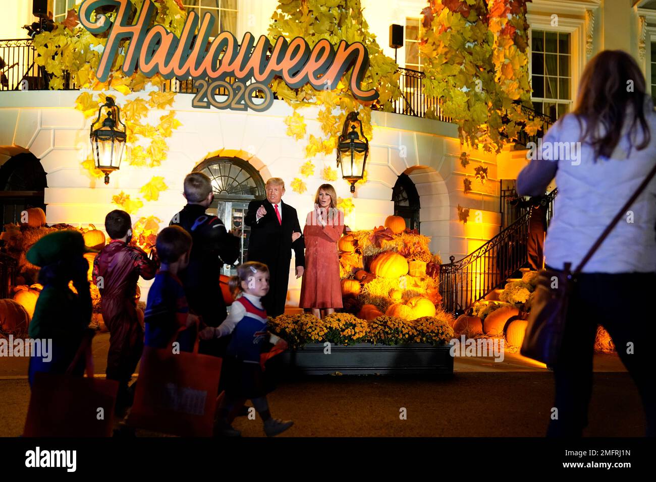 President Donald Trump and first lady Melania Trump greet trick-or ...