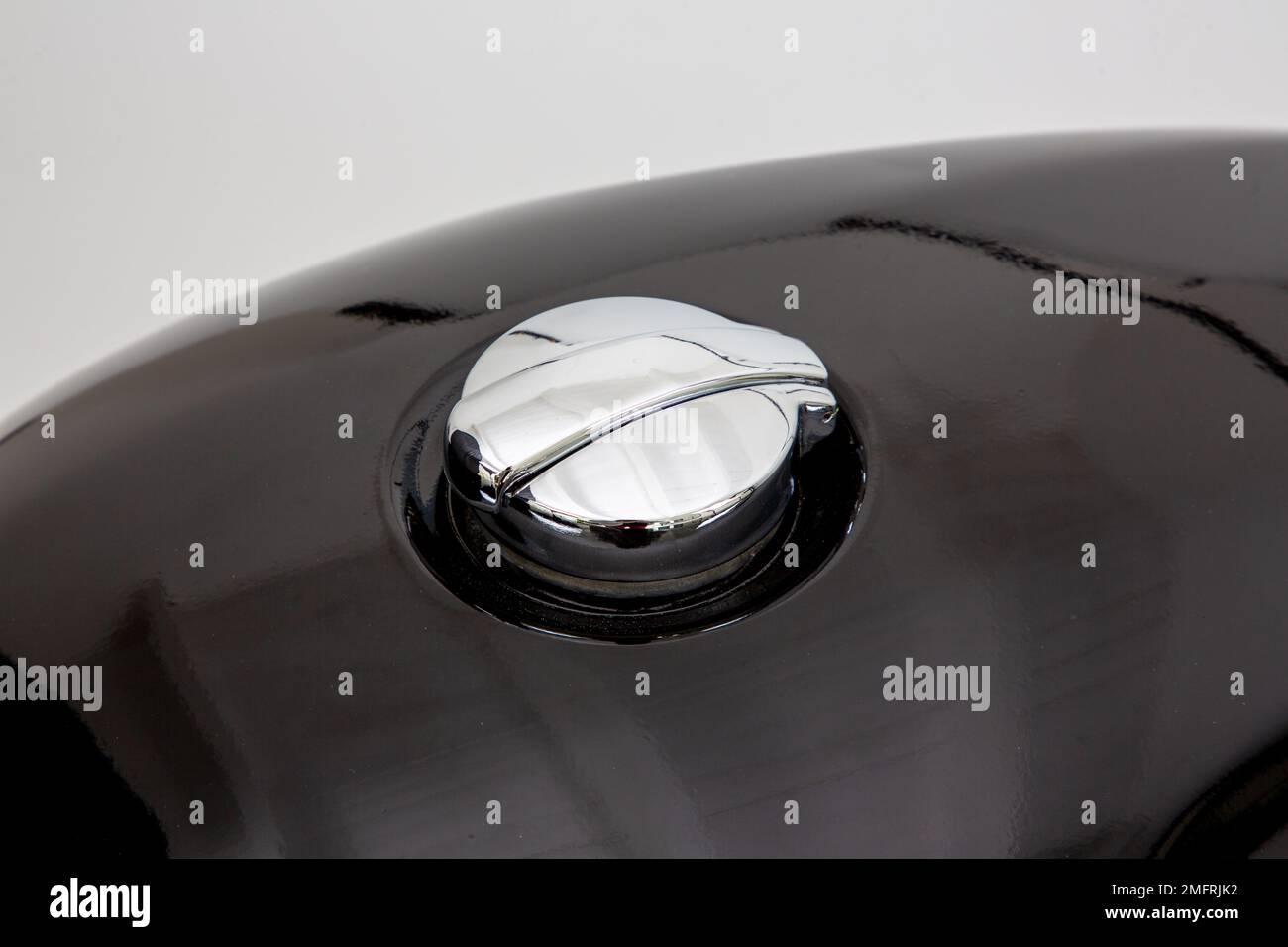 Black fuel tank of a motorbike and chrome lock Stock Photo - Alamy
