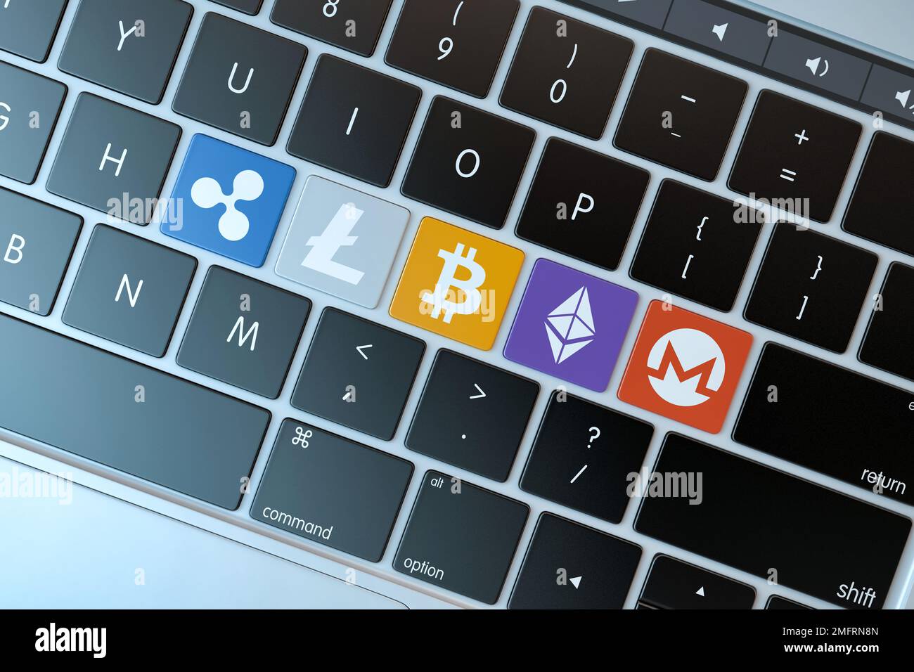 Various cryptocurrencies symbols on laptop keyboard. Technology concept ...