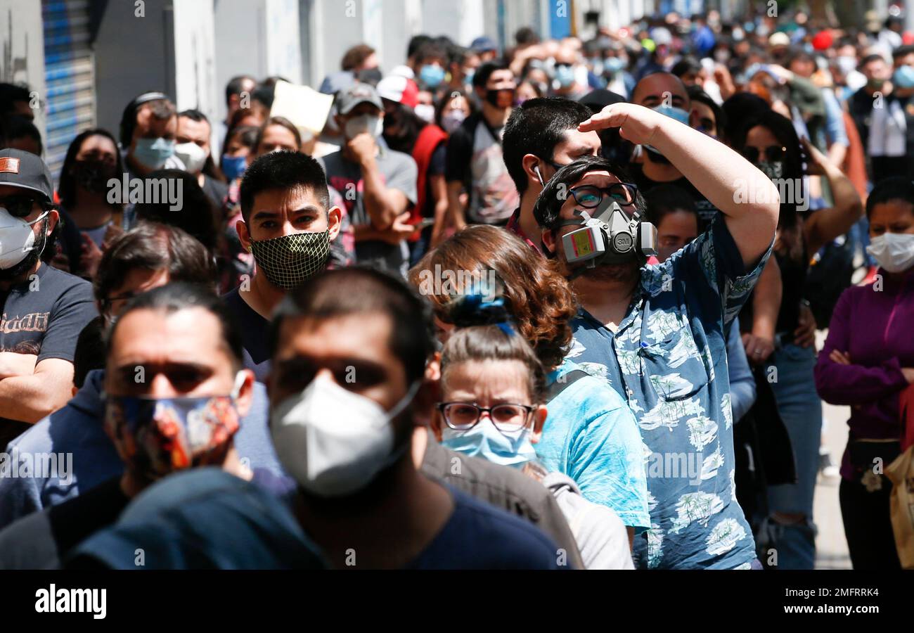 People line up for their turn to vote during a referendum to decide ...