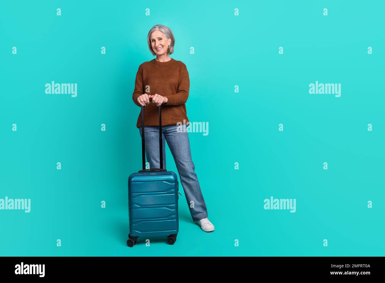 Full size photo of positive nice person hold suitcase empty space blank ...