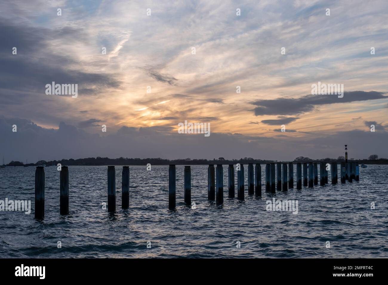 wooden groynes in the sea at Bosham West Sussex England at sunset Stock ...