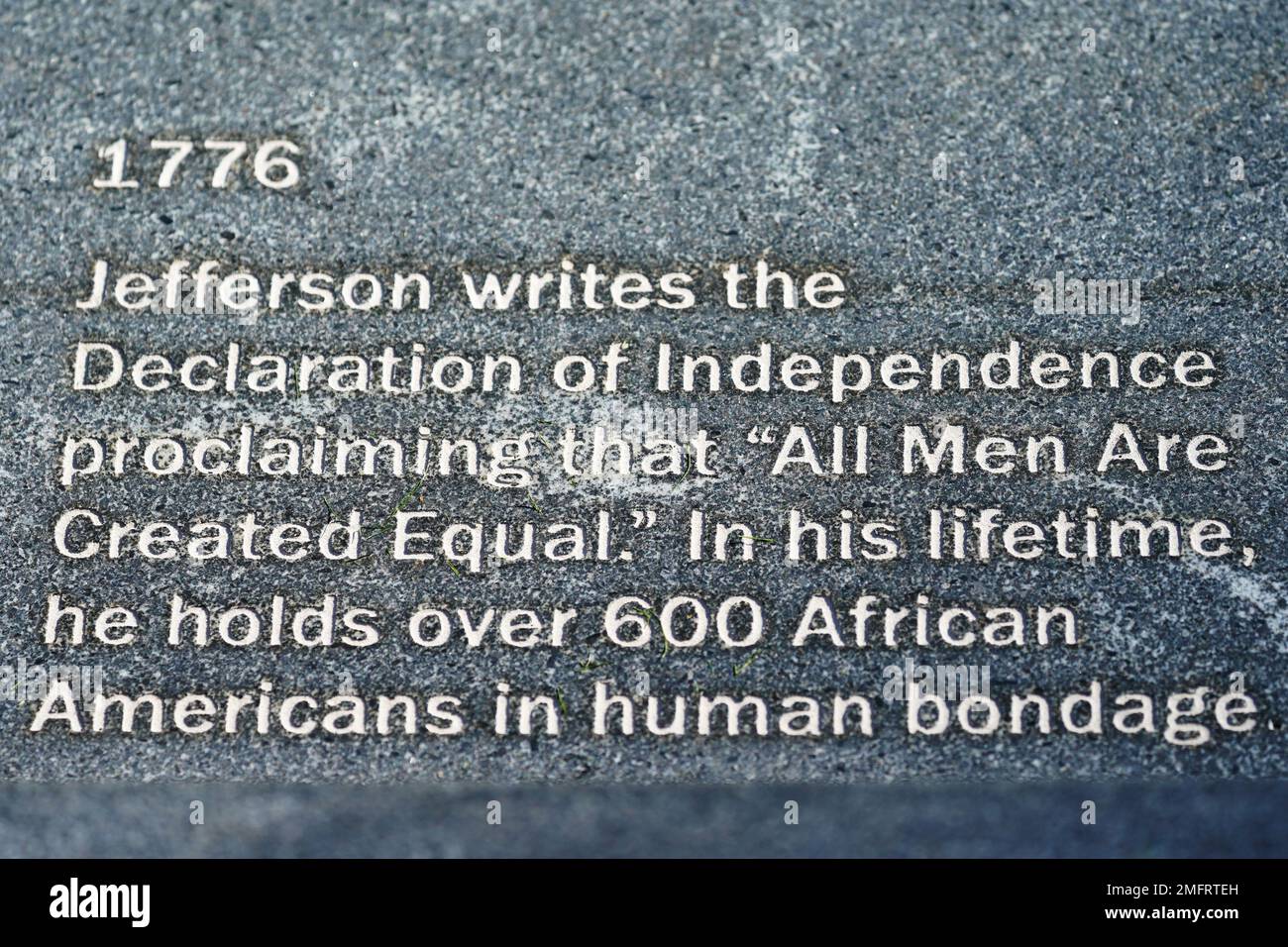 An inscriptions is shown on the wall of the Memorial to Enslaved ...