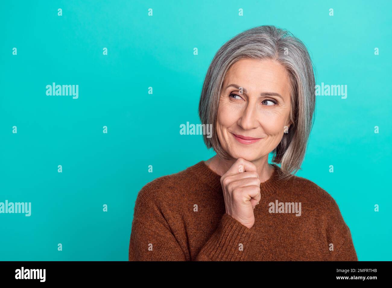 Photo of minded lady hand touch chin look interested empty space ...