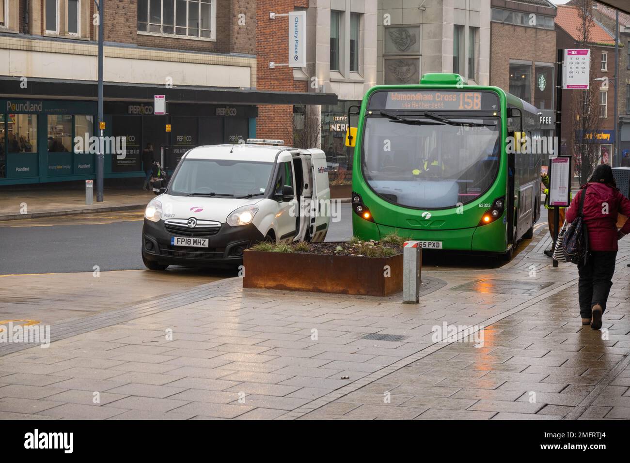 Coach broken down with breakdown van parked next to it in Norwich city ...