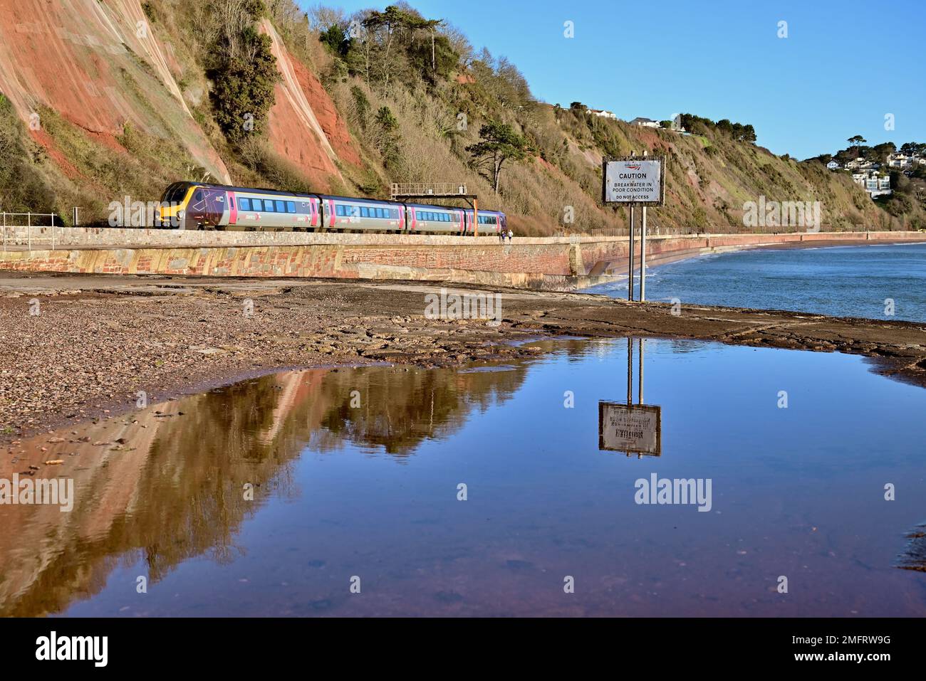 A Cross Country train along the seawall between Hole Head (Parsons ...