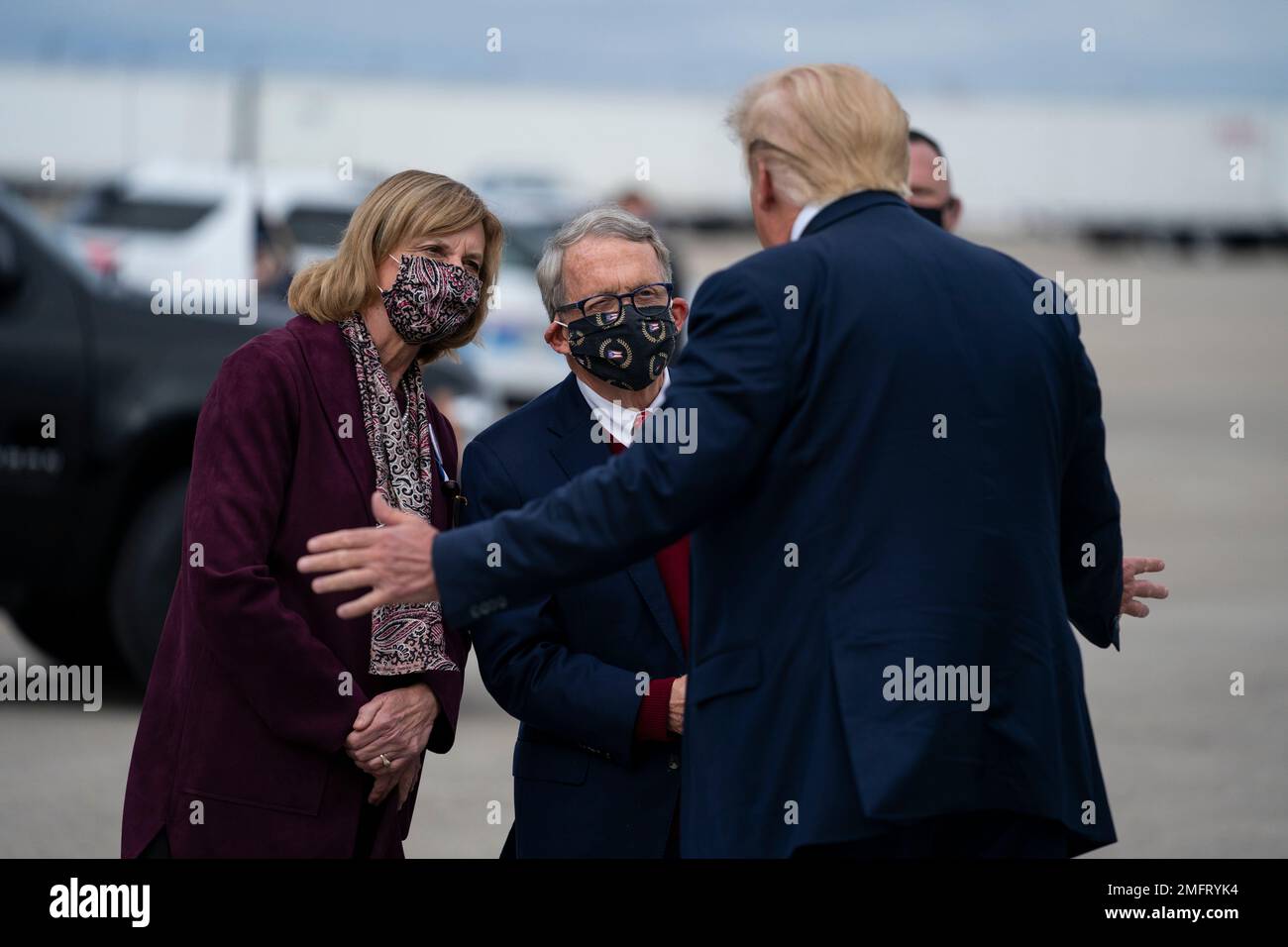 President Donald Trump talks to Gov. Mike DeWine, R-Ohio, and his wife ...