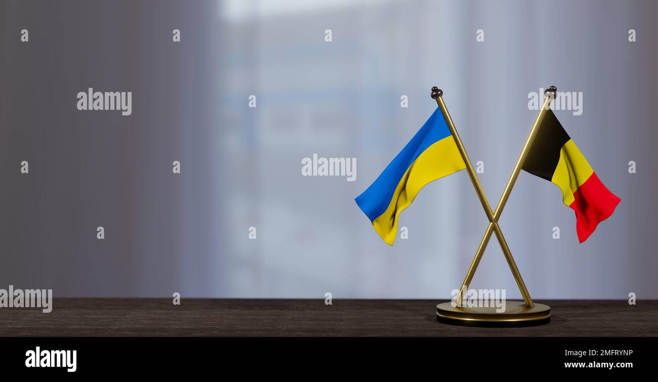 Ukraine and Belgium flags on table. Negotiation between Belgium and ...